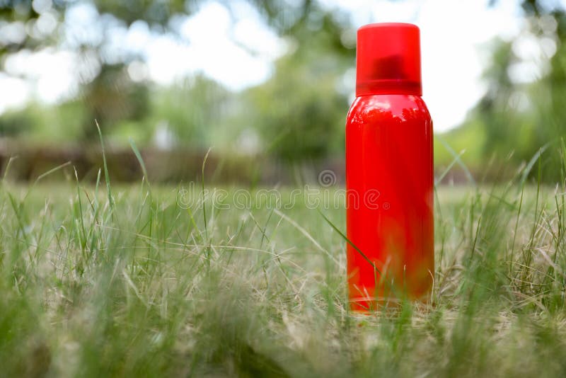 Bottle of Insect Repellent Spray on Grass. Space for Text Stock Image ...