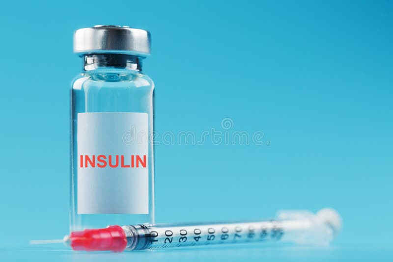 A Bottle of Insulin Hormone and a Syringe on the Table Stock Image ...