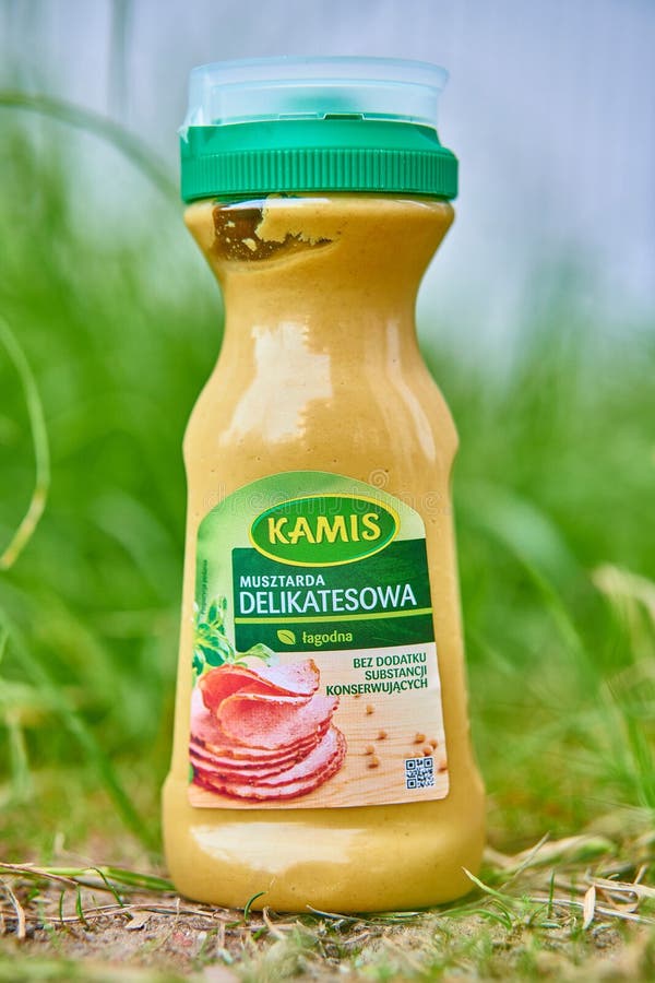 Bottle of Kamis Brand Yellow Mustard on Green Grass. Editorial ...