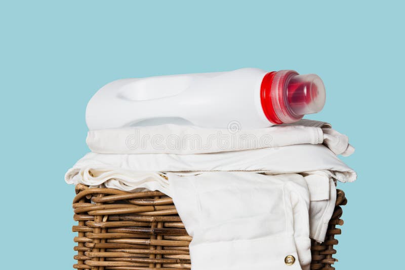 Laundry Detergent and Freshly Folded White Clothes Stock Photo - Image ...