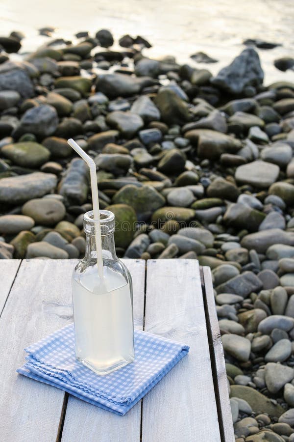 Bottle with Lemonade at the Beach Stock Image - Image of bank, fruit ...
