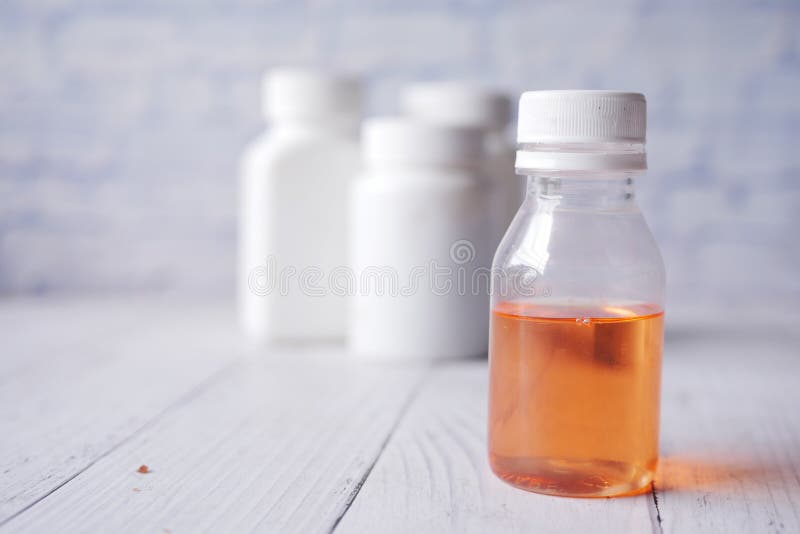 Bottle with Liquid Medicine on White , Stock Photo - Image of ...