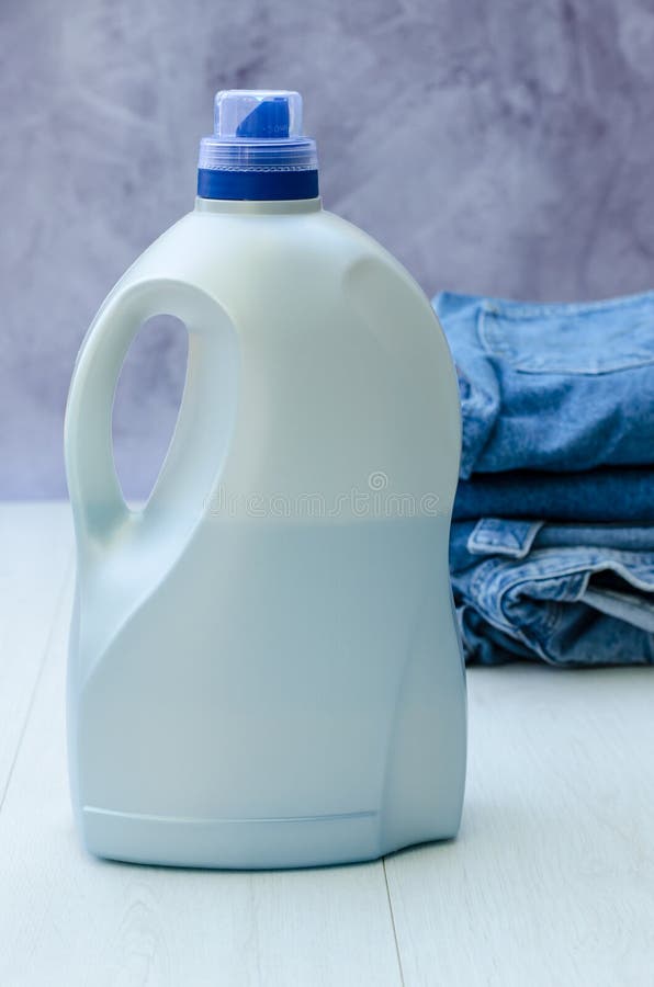 A Bottle of Liquid Powder in the Foreground and a Stack of Things Stock ...