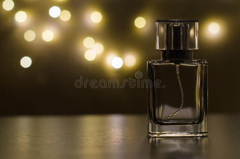 Bottle of Men`s Perfume on a Background of Festive Lights Stock Photo ...