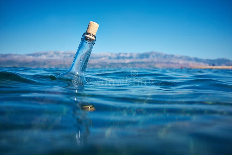 Bottle with a Message in Water Stock Image - Image of space, island ...