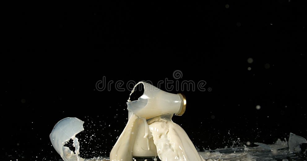Bottle of Milk Exploding Against Black Background Stock Photo - Image ...