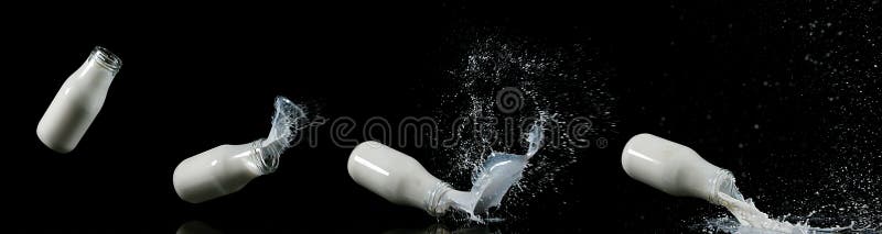 Bottle of Milk Falling and Exploging Against Black Background Stock ...