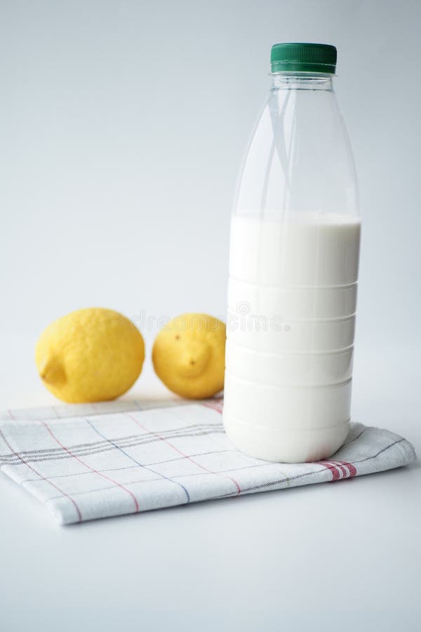 Bottle of Milk and Yellow Lemon on White Background Stock Image - Image ...