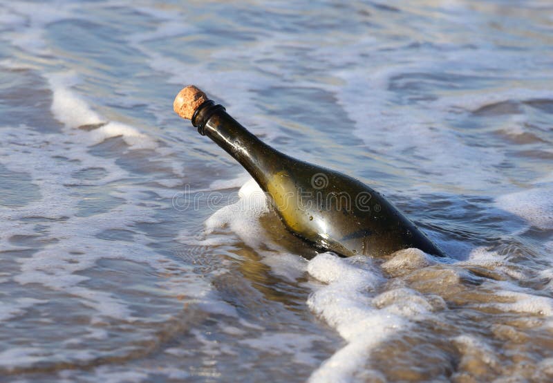 Bottle in the Ocean with a Secret Message Stock Image - Image of ...