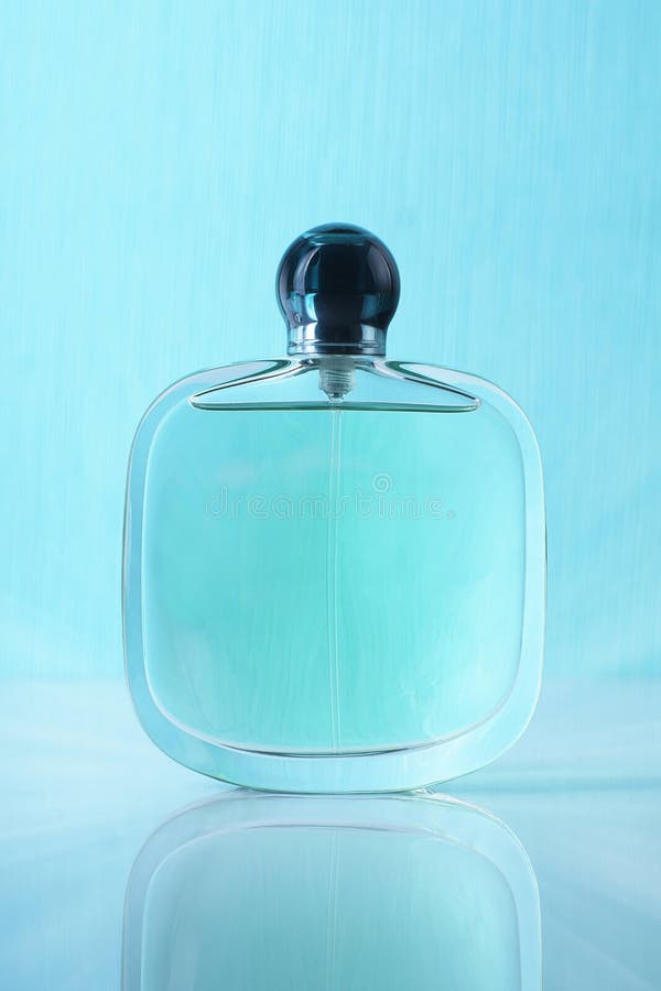 Bottle with Perfume on a Blue Background with Reflection Stock Photo ...