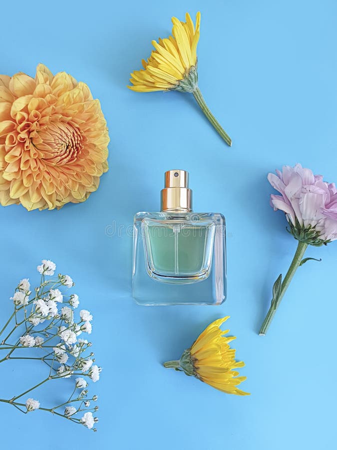 Bottle Perfume Flower Spring Creative Essence on a Colored Background ...