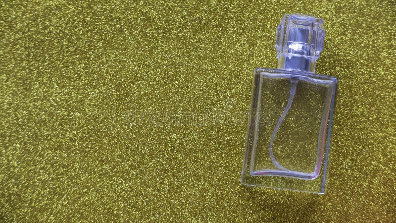 A Bottle of Perfume on a Glitter Gold Background Stock Image - Image of ...
