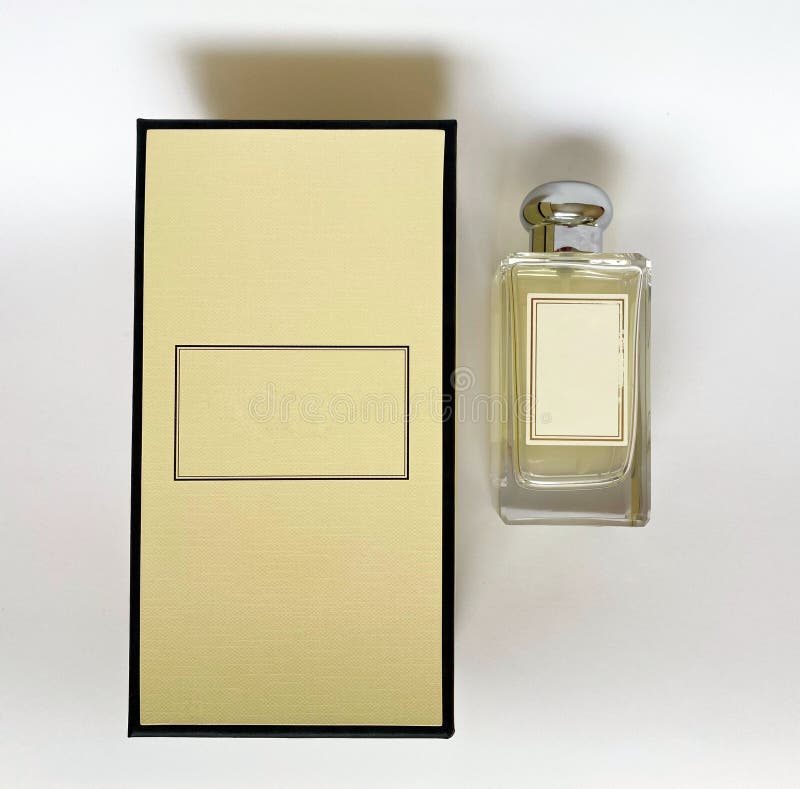 A Bottle of Perfume from a Yellow Box on a White Isolated Background ...