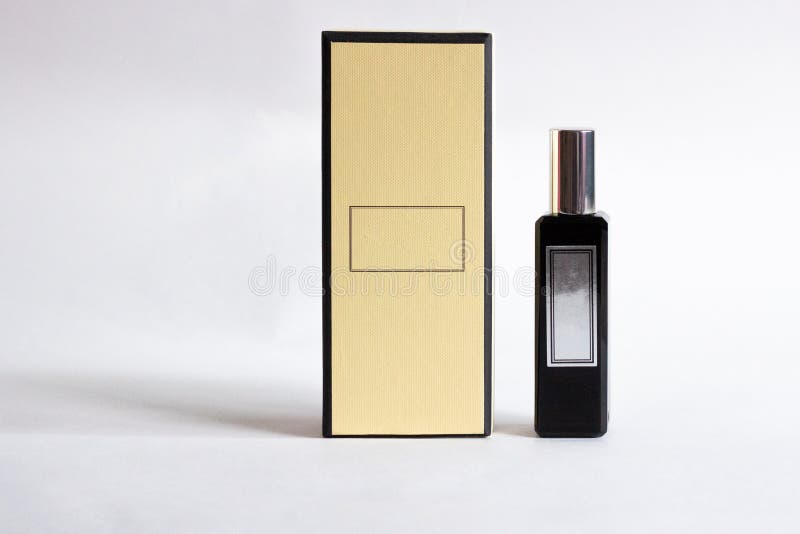 A Bottle of Perfume from a Yellow Box on a White Isolated Background ...