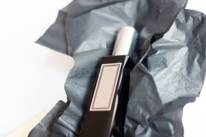 A Bottle of Perfume from a Yellow Box on a White Isolated Background ...