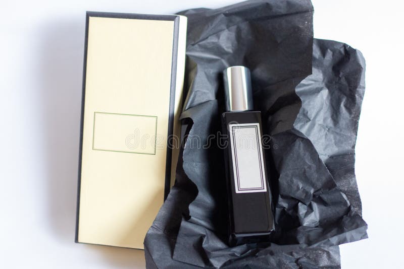 A Bottle of Perfume from a Yellow Box on a White Isolated Background ...