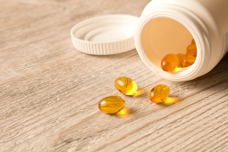 A Bottle of Pills Scattered Around the Table . Birth Control Pills ...