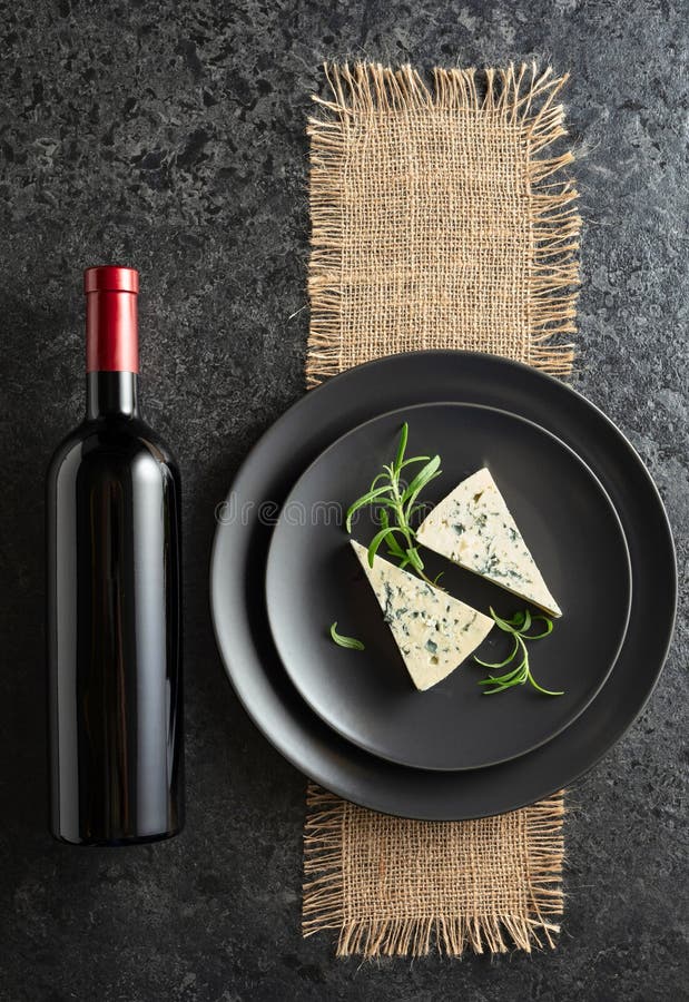 Bottle of Red Wine and Blue Cheese on a Black Plate Stock Image - Image ...