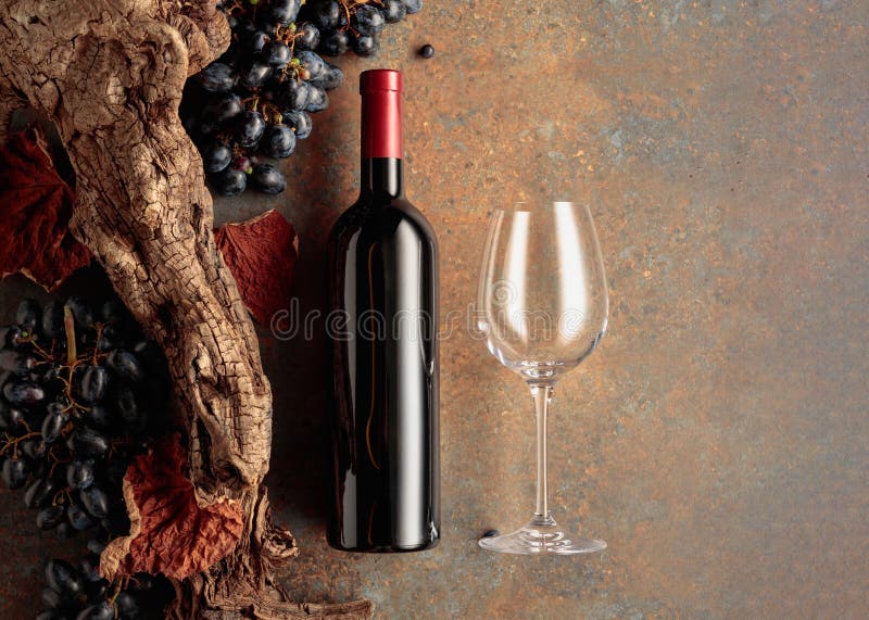 Bottle of Red Wine with Blue Grapes on a Rusty Background Stock Photo ...
