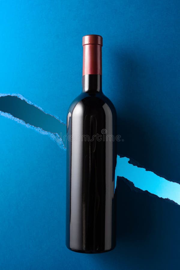 Bottle of Red Wine on a Dark Blue Background Stock Photo - Image of ...