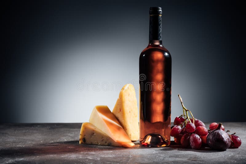 Bottle of Red Wine Different Types of Delicious Cheeses and Grapes ... Bottle of Red Wine Different Types of Delicious Cheeses and Grapes ...