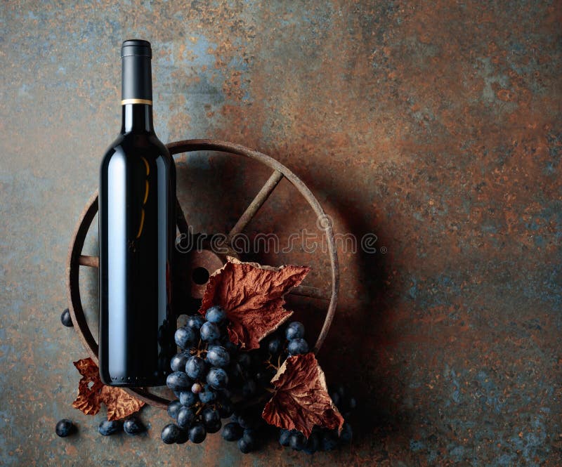 Bottle of Red Wine with an Old Rusty Wheel Stock Image - Image of ...