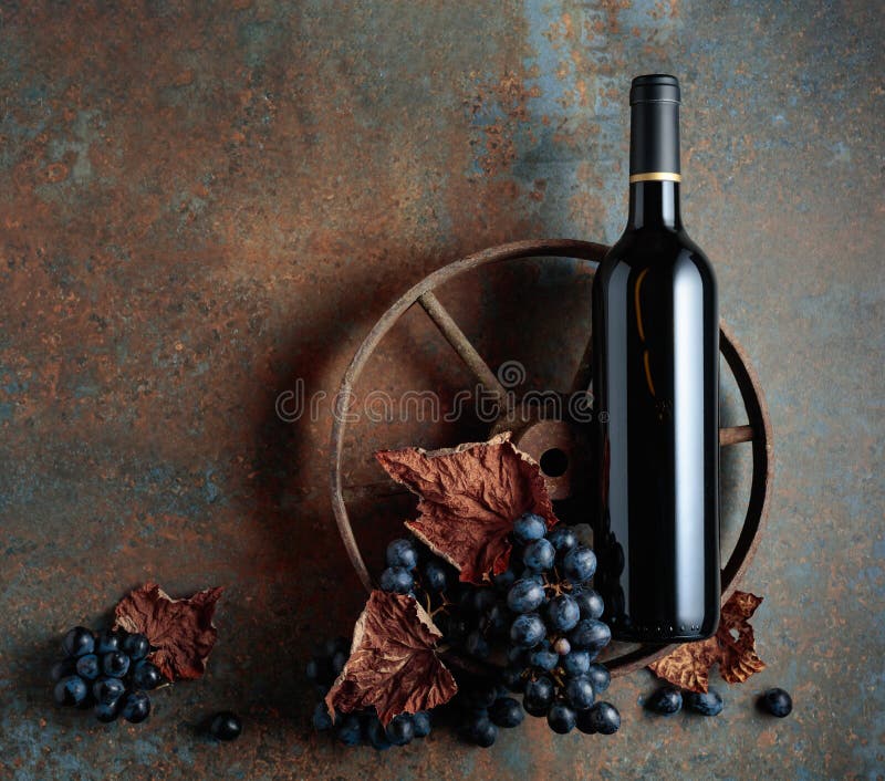 Bottle of Red Wine with an Old Rusty Wheel Stock Photo - Image of ...