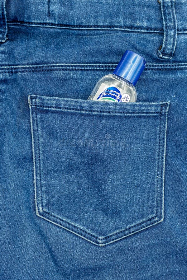 A Bottle of Sanitizing Alcohol Hand Gel in the Back Pocket of a Pair of ...