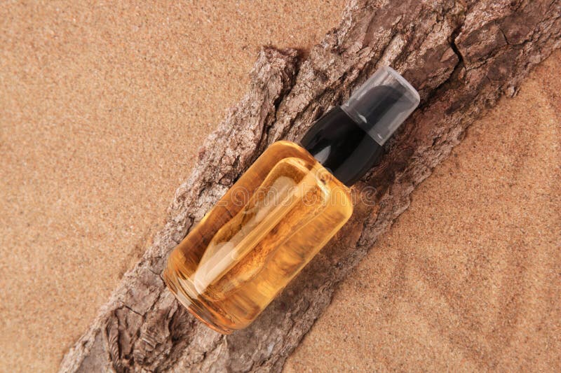 Bottle of Serum and Tree Bark on Sand, Top View Stock Image - Image of ...