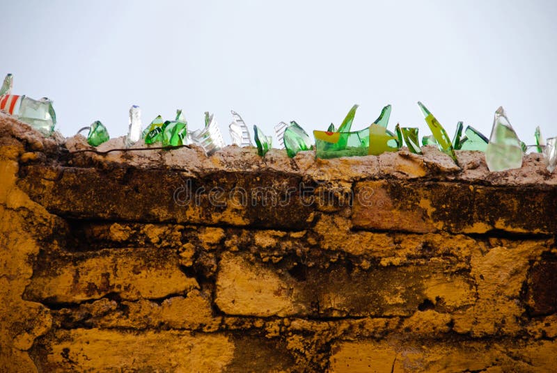 Bottle-shards on a wall stock photo. Image of glass, prison - 7185070
