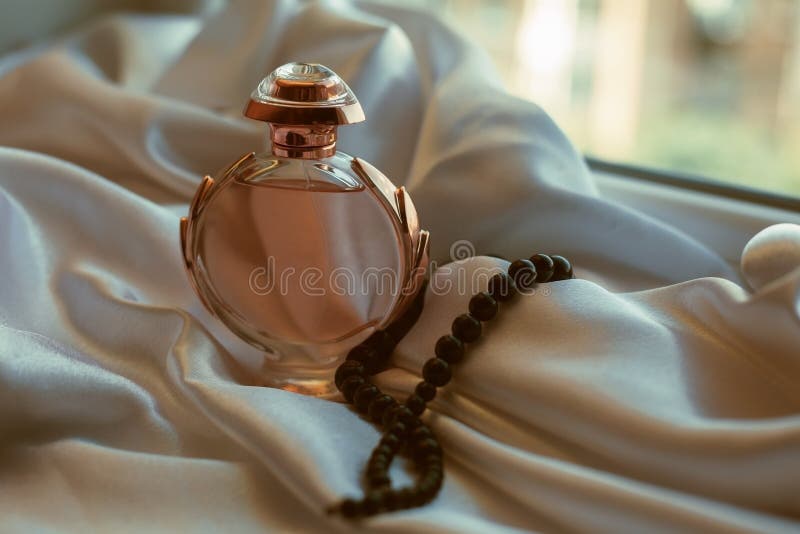 Stylish perfume and pearls stock image. Image of white - 321036427