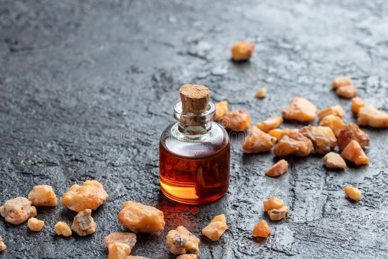 A Bottle of Styrax Benzoin Essential Oil and Benzoin Resin Stock Photo ...