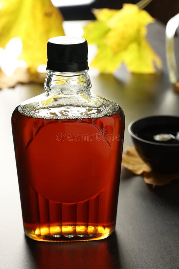 Bottle of Tasty Maple Syrup on Grey Table Stock Photo - Image of maple ...