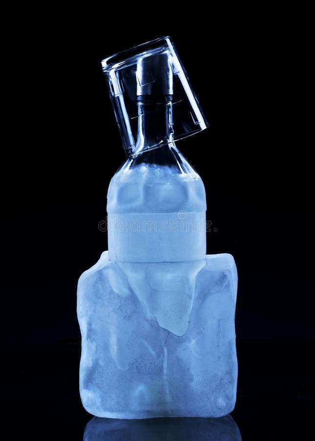 Bottle of Vodka in a Big Ice Cube Stock Photo - Image of expectation ...