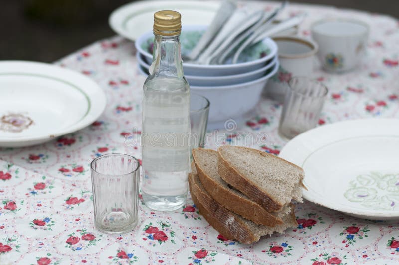 Bottle of Vodka, Fresh Bread and Plates Stock Photo - Image of ...