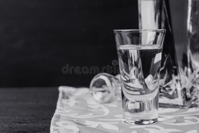 Bottle of Vodka with Glasses on the Wooden Table Stock Photo - Image of ...