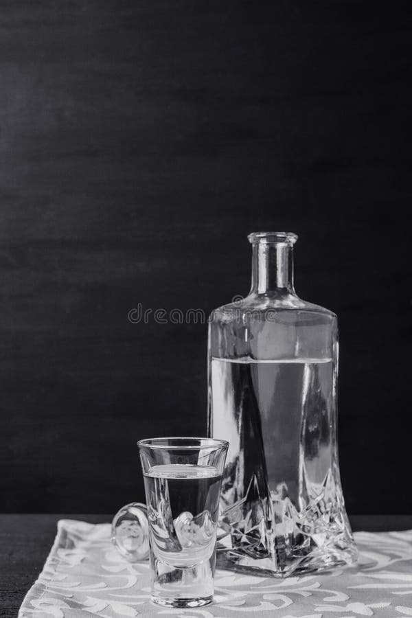 Bottle of Vodka with Glasses on the Wooden Table Stock Image - Image of ...