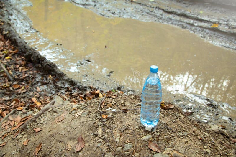 Bottle of Water with a Dirty Road Water Stock Illustration ...