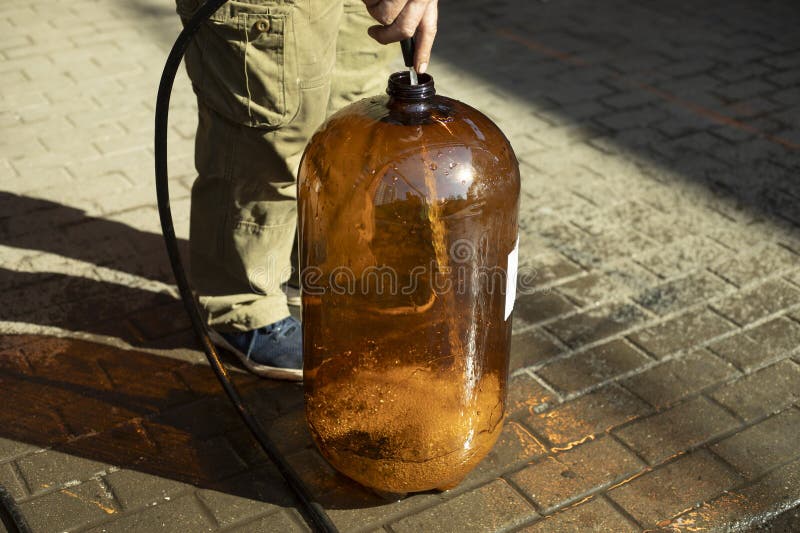 A Bottle of Water. Filling a Canister with Water Stock Photo - Image of ...