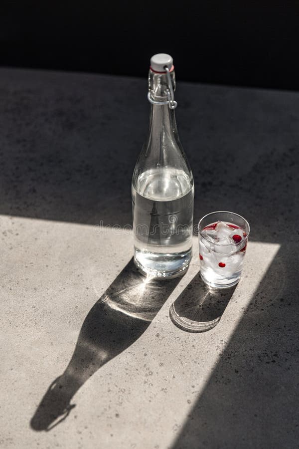Bottle of Water and Glass with Ice and Cranberries Stock Photo - Image ...