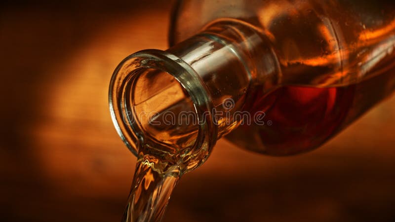 Bottle of Whiskey with Pouring Liquid Stock Image - Image of whiskey ...
