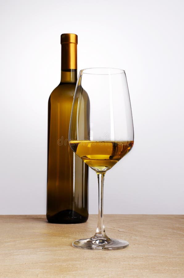 Bottle of White Wine with Glass Flat on the Table Stock Photo - Image ...