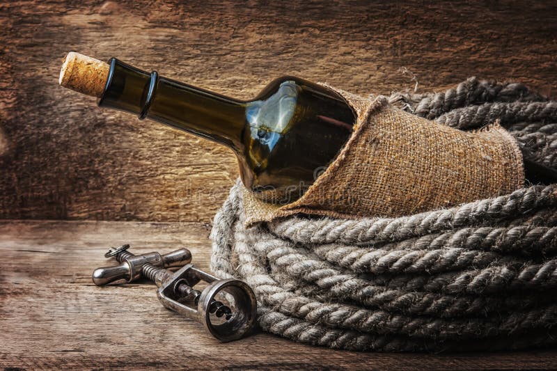 Bottle Of Wine Wrapped With Rope Stock Image - Image of glass, wooden ...
