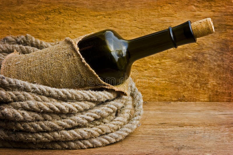 Bottle wrapped with rope stock photo. Image of wooden - 18629110