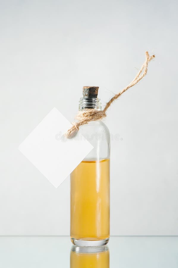 Bottle with Yellow Liquid and Empty Label on the Light Backgroun Stock ...