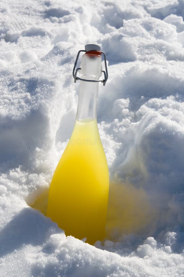 Bottle with a Yellow Liquid on a Snow Stock Photo - Image of winter ...
