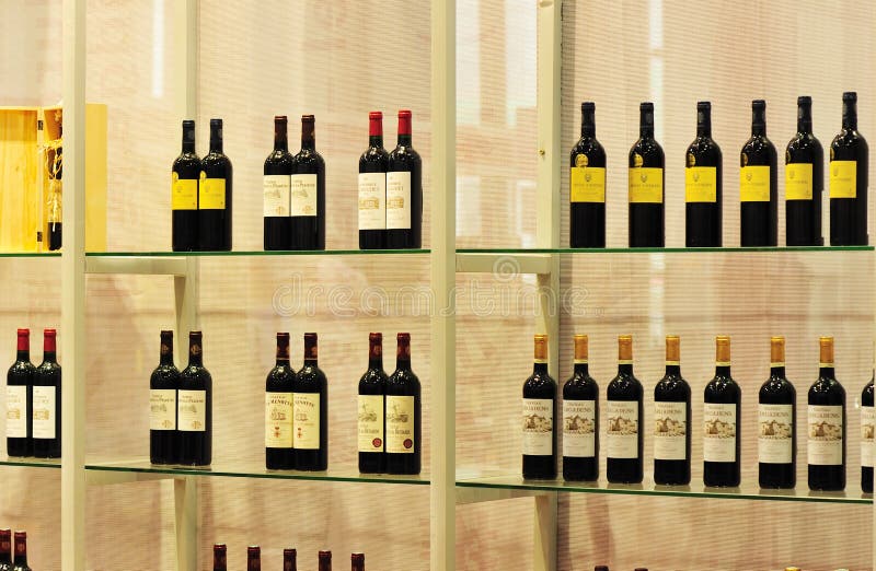 Bottled alcohol on shelf editorial photography. Image of convention ...