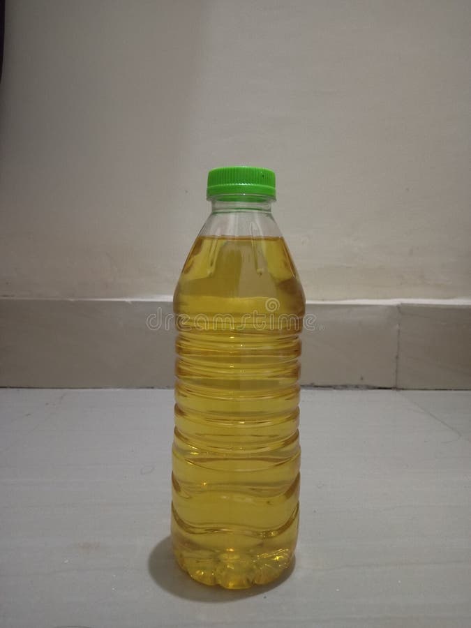Bottled golden cooking oil stock image. Image of cooking - 273106937