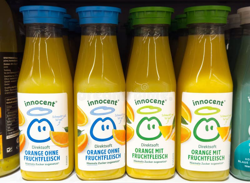 Bottled Orange Juice Variants with Pulp Displayed on Store Shelf ...