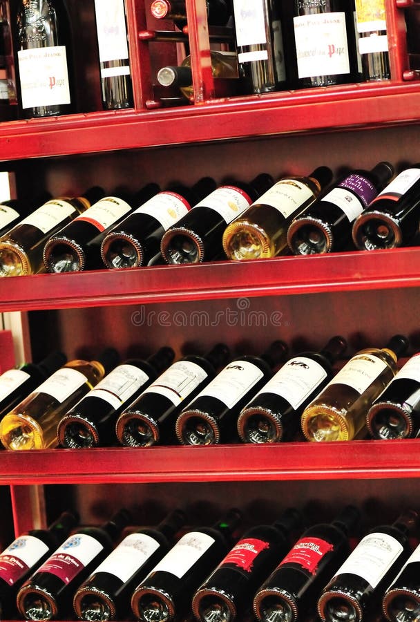 Bottled red wines on shelf editorial stock image. Image of glass - 26369049